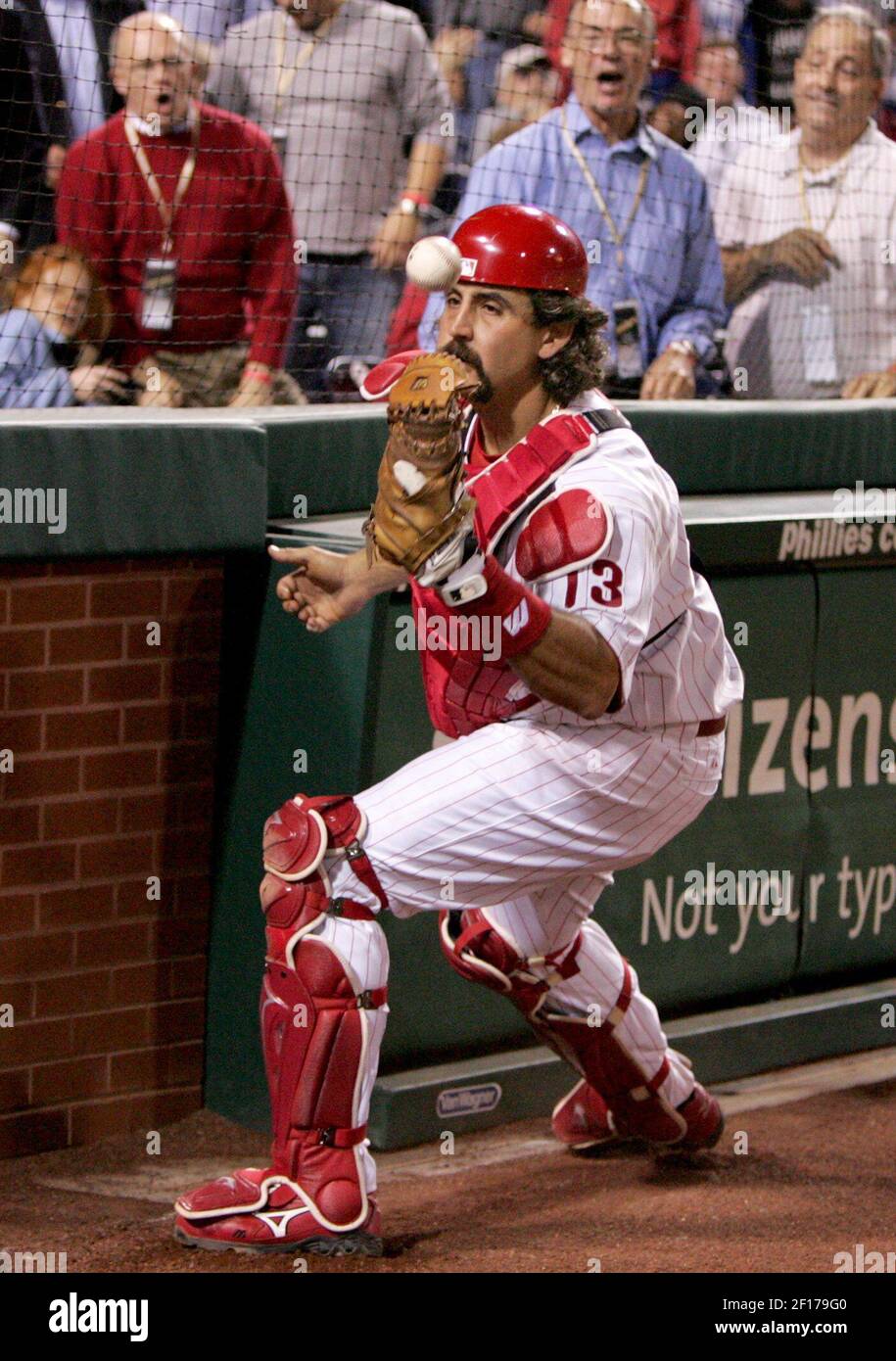 Philadelphia Phillies' catcher Sal Fasano can quite get to the foul ...
