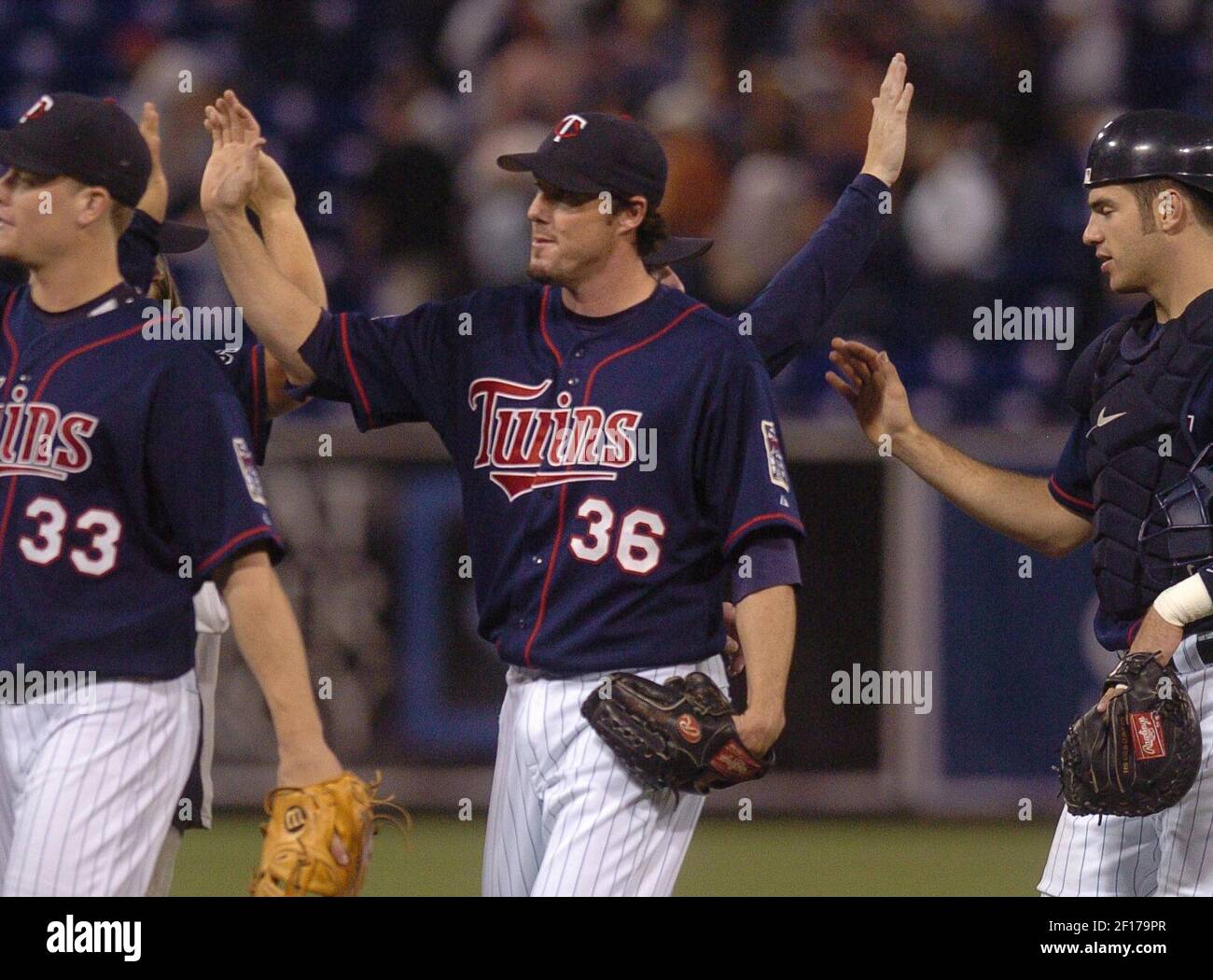 Minnesota Twins' Justin Morneau, right, Joe Nathan, center, and Joe ...