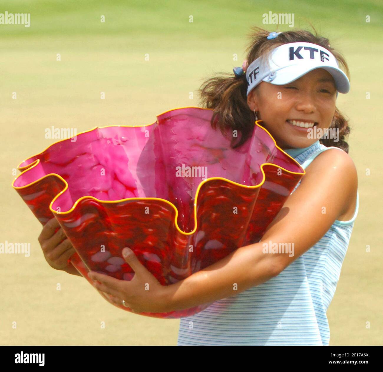 Mi Hyun Kim, of South Korea, holds the trophy after winning the Ginn ...