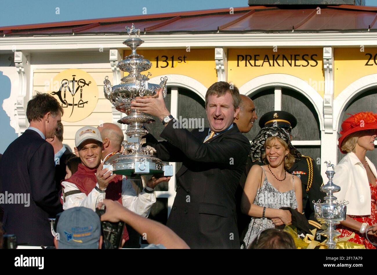 Rider Javier Castellano of Bernardini holds the trophy with John ...