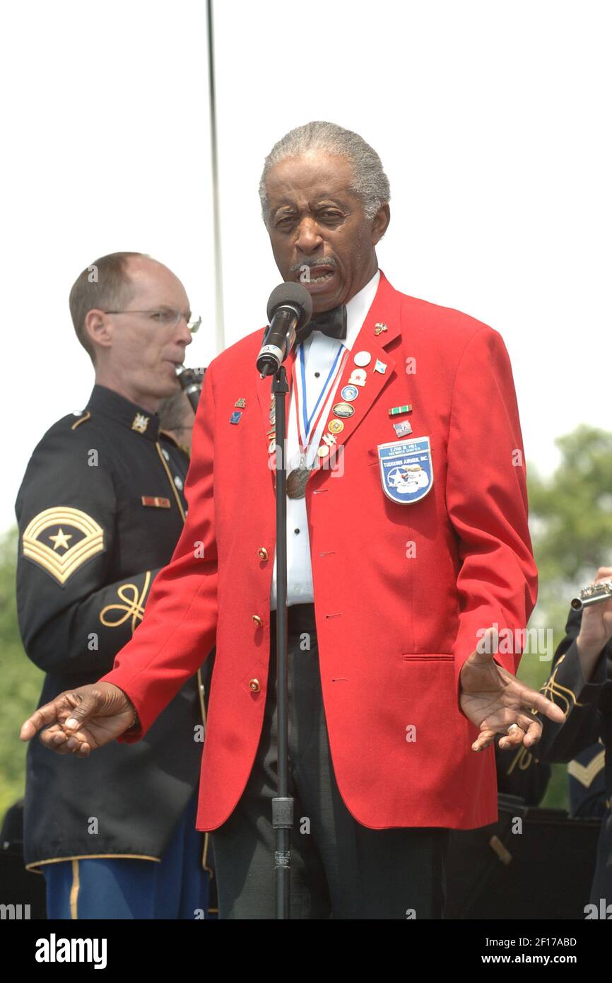 Former Tuskegee airman Ezra M. Hill, Sr., sings the national anthem at ...