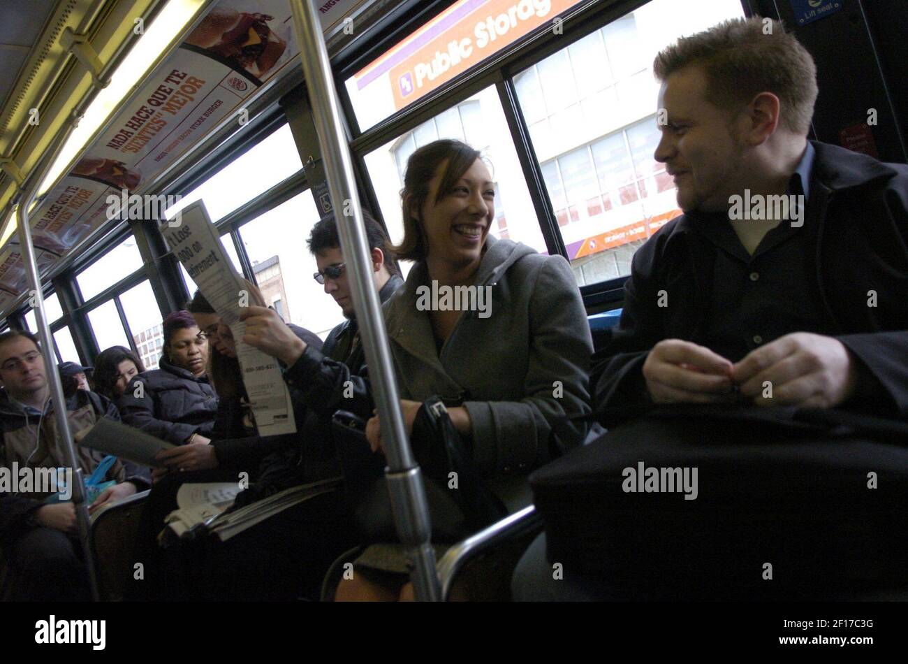 Sara Hall, 23, chats with Matt Marquis, 32, (right) while riding the ...