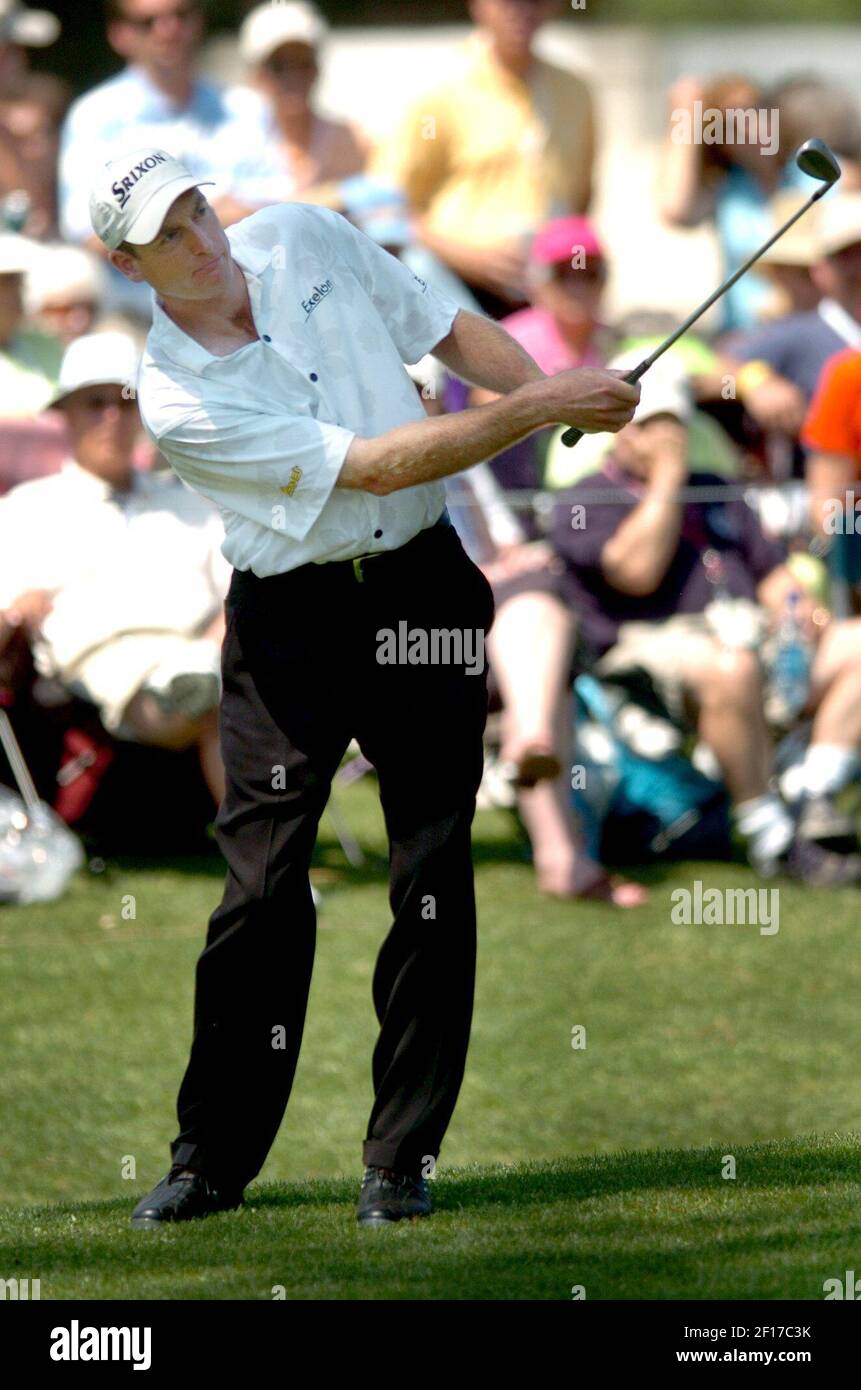 Jim Furyk hits his third shot from the back of the ninth green, which ...