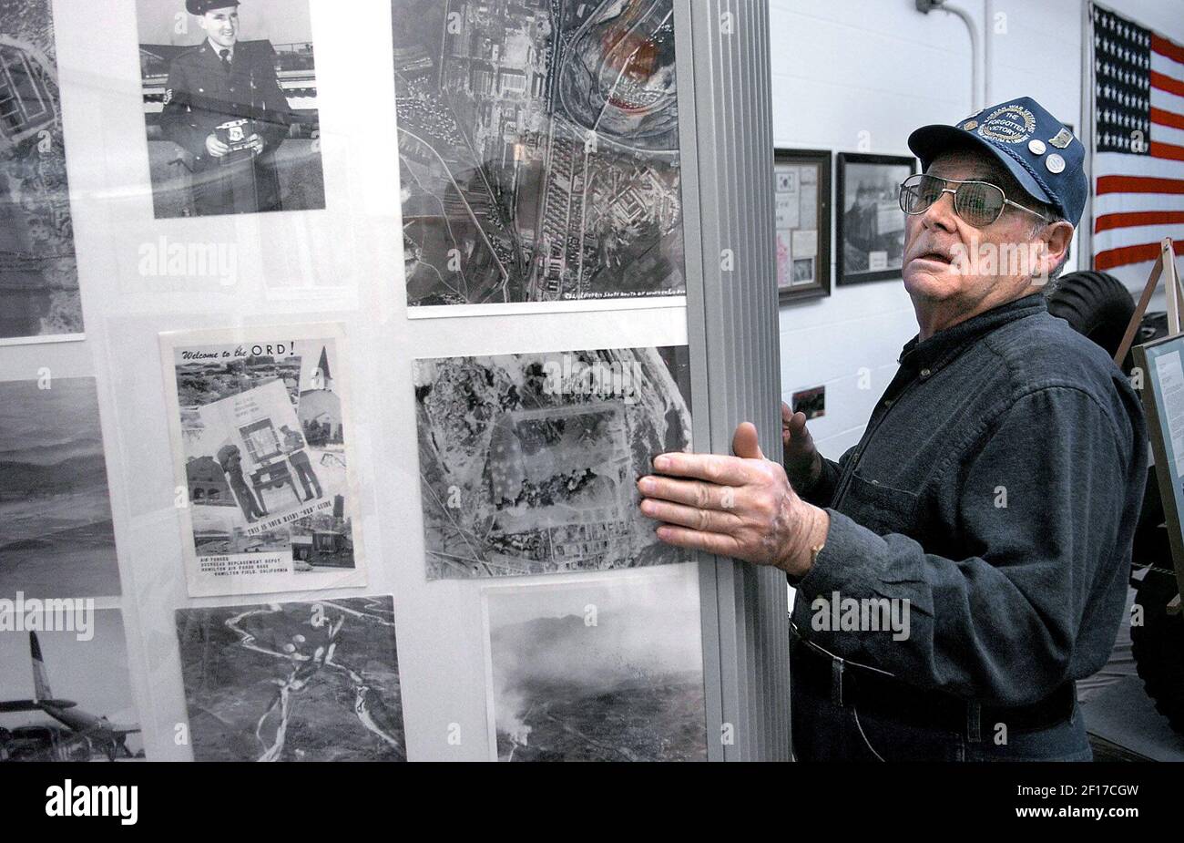 Volunteer and Korean War veteran Roy Rutherford checks some displays at ...