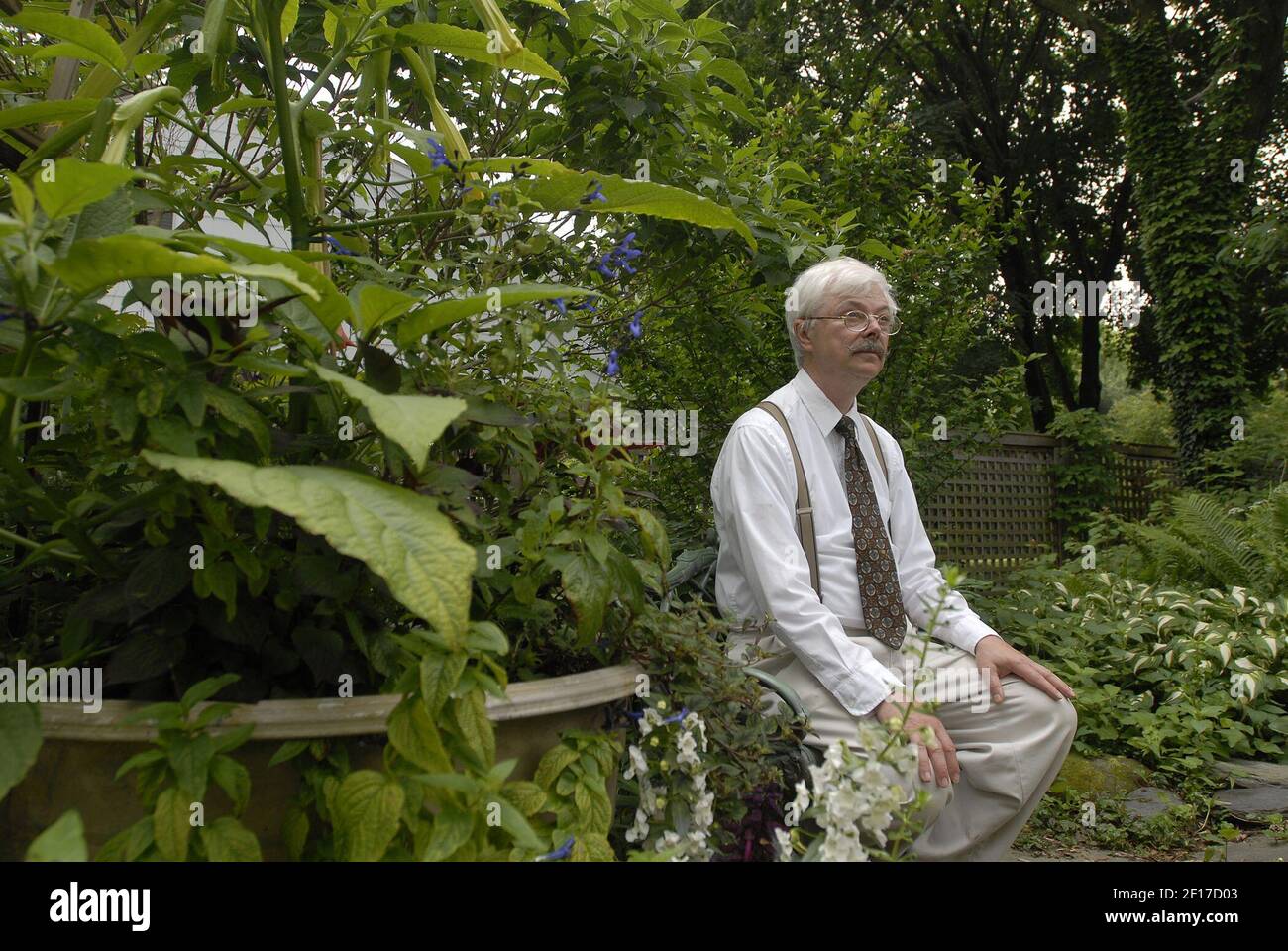 Tom Steigerwald enjoys shade (as do the plants) in the garden he and ...