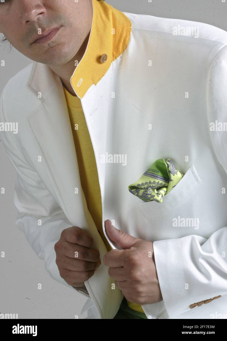 Alex Fernandez models a white cotton jacket by Etro, $995; silk pocket ...