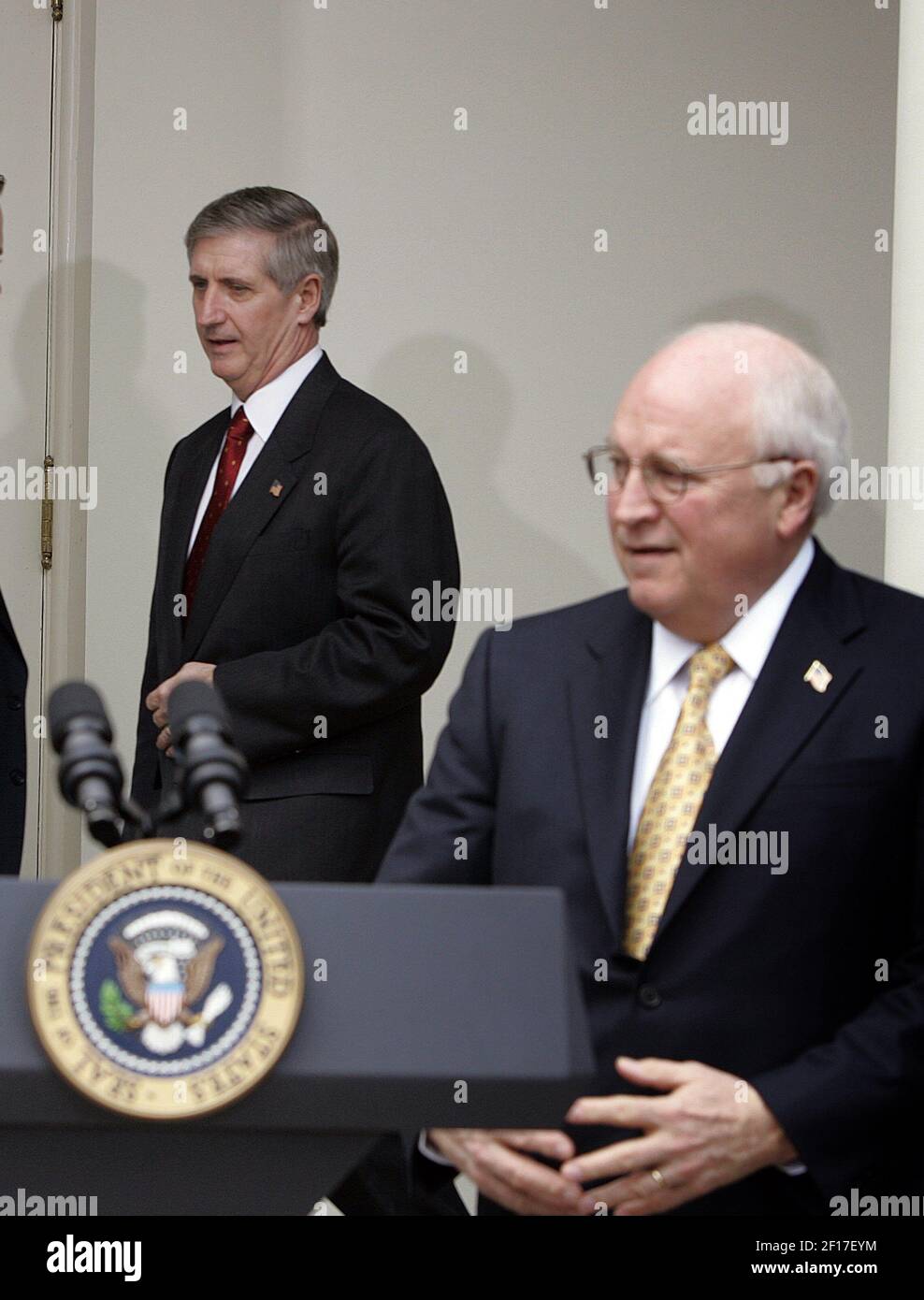 Outgoing White House Chief of Staff Andrew Card, center, walks to the ...