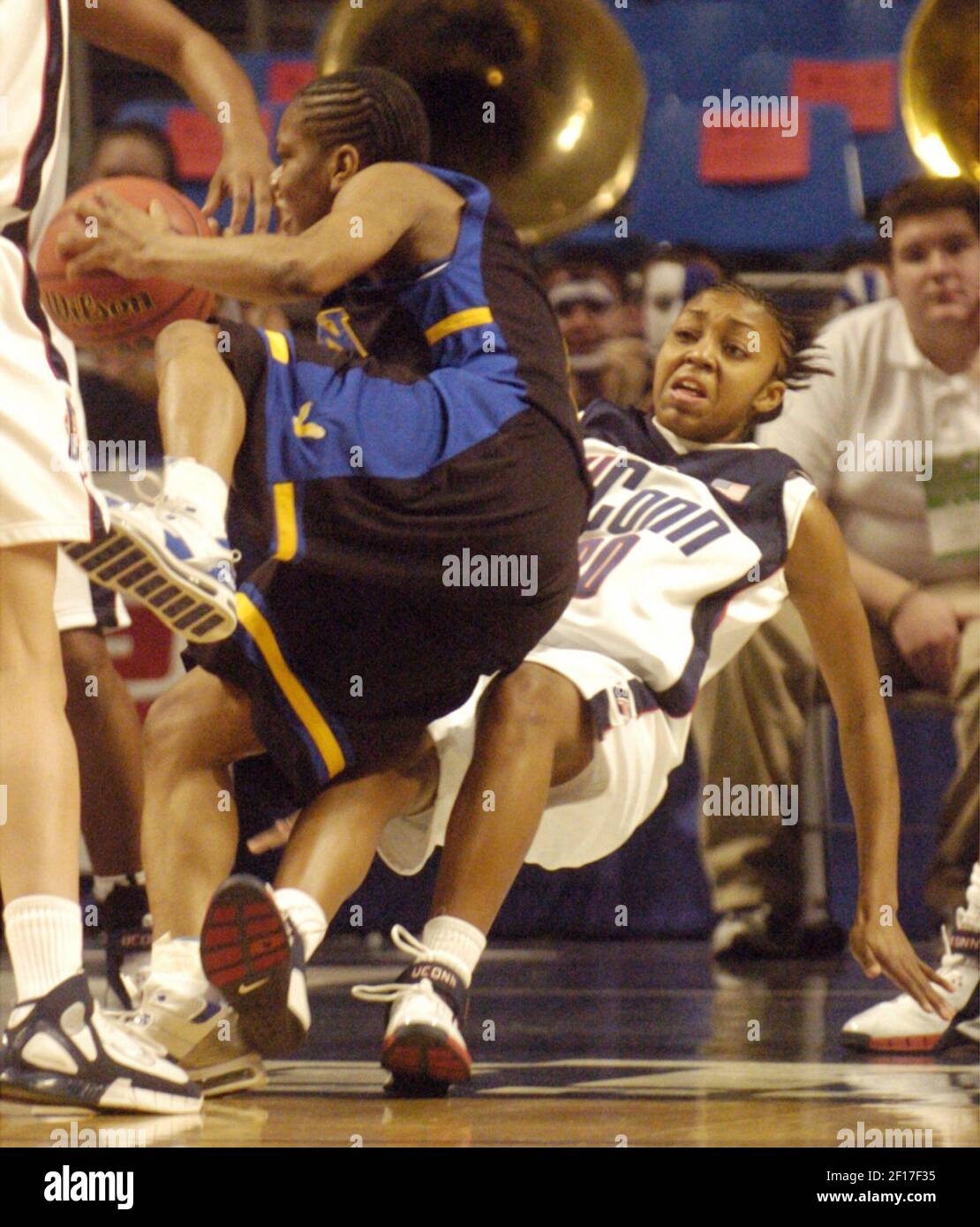 Connecticut's Renee Montgomery (right) draws the charging foul on ...