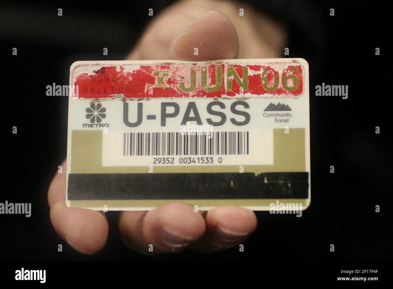 Mark Hallenbeck's U-Pass shows the wear and tear it's gotten. His ...