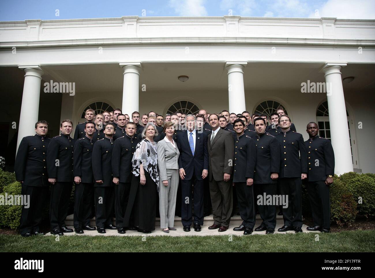 President George W. Bush poses for a photo with first lady Laura Bush ...