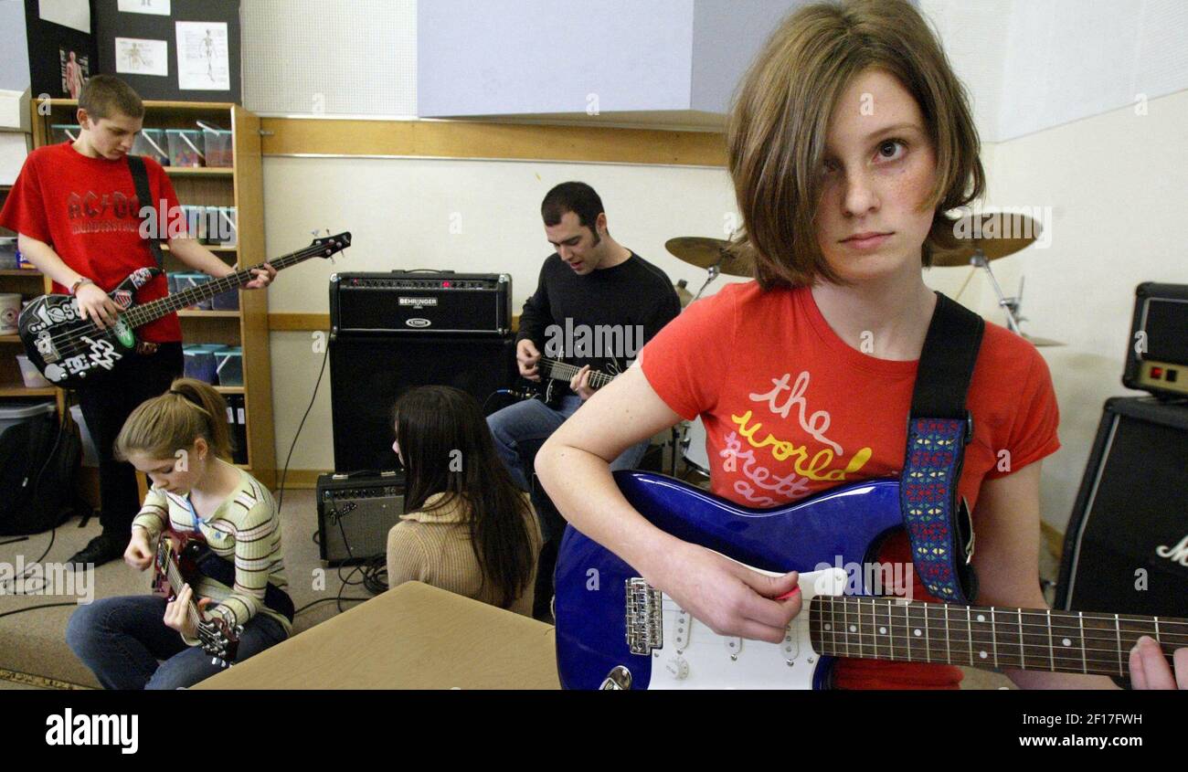 Mike Anderson, background center, instructs students from left; Jake ...