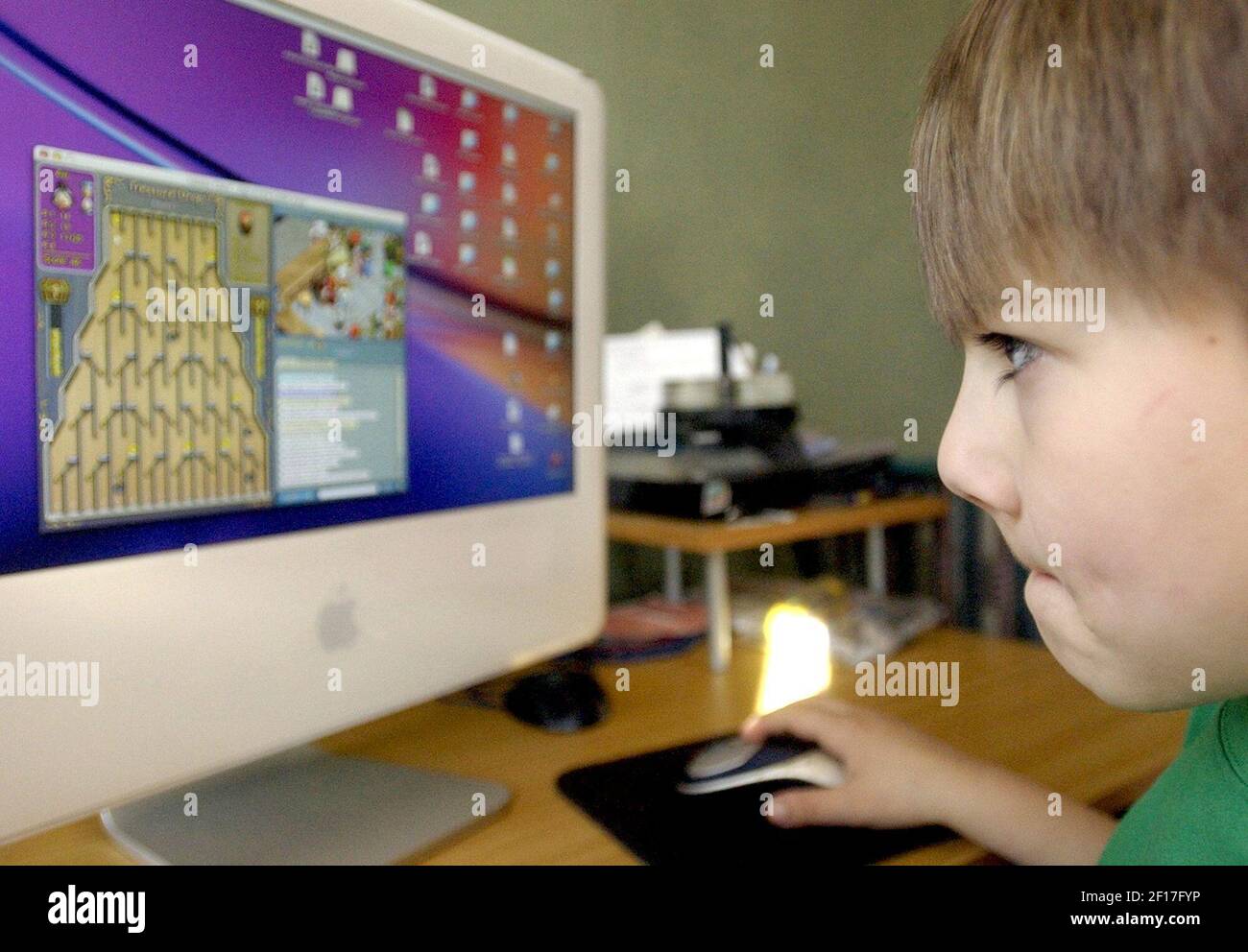 Brady Cassada, 7, plays the interactive online computer game called ...