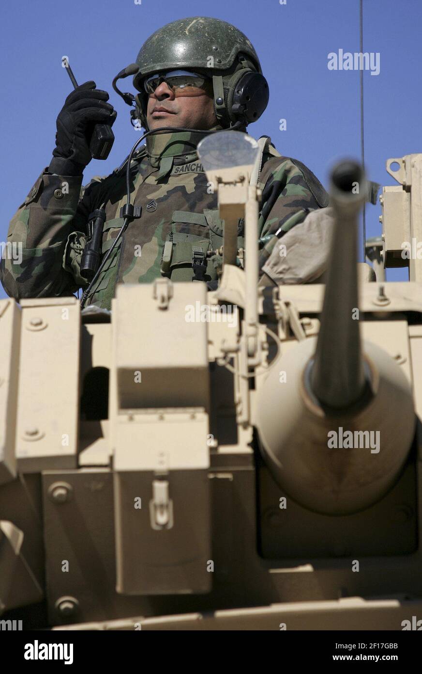 Staff Sgt. Reyes Sanchez listens to radio communications during a ...