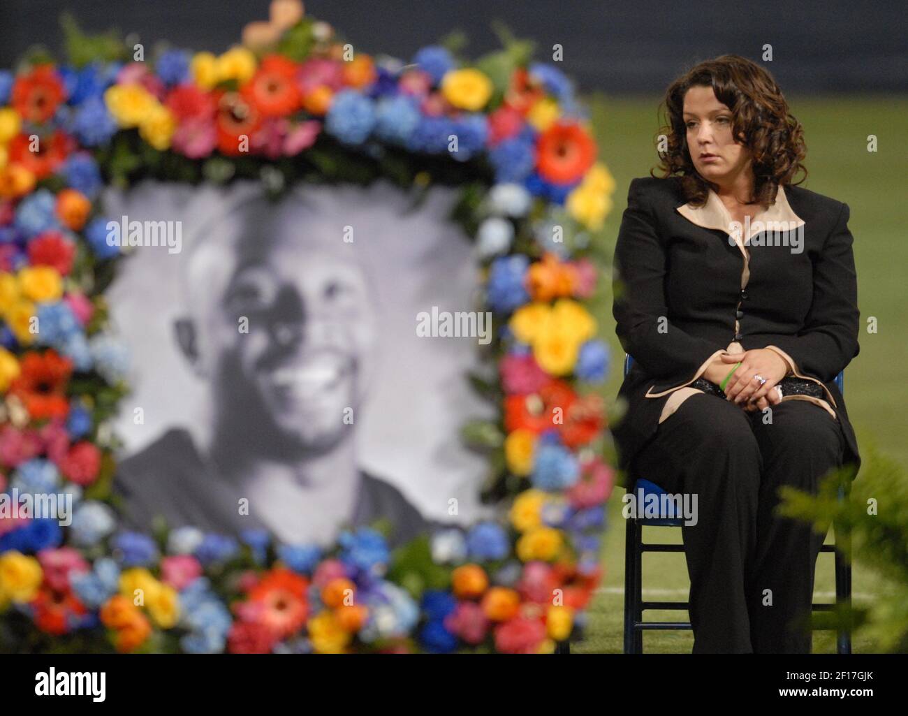 Jodi Olson, fiance of the late Kirby Puckett, sits behind a portrait of ...