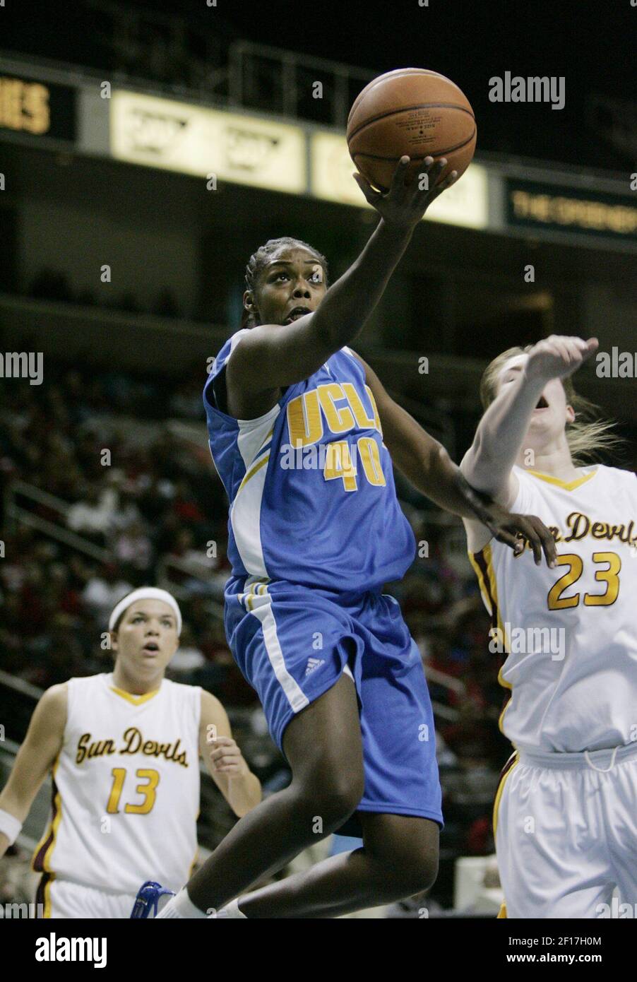 Lisa Willis (40) of UCLA scores on Arizona State's Kristen Thompson in ...