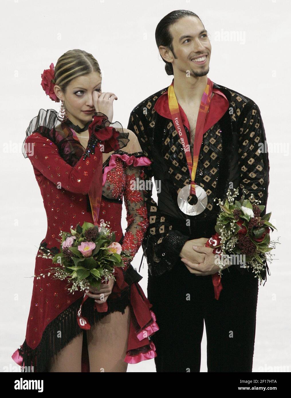 Tanith Belbin wipes a tear as she and partner Benjamin Agosto of USA ...