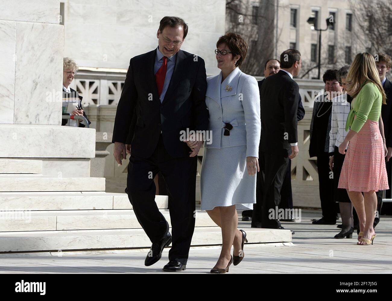 Associate Justice Samuel Alito walks with his wife Martha following his ...