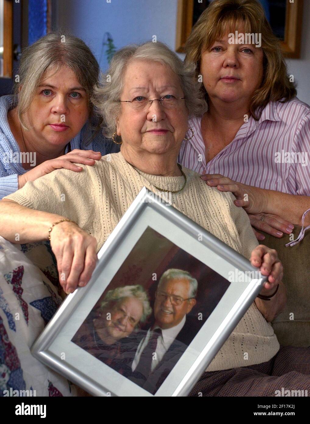 Margaret Attwood, of Yelm, sits with her two daughters, from left ...