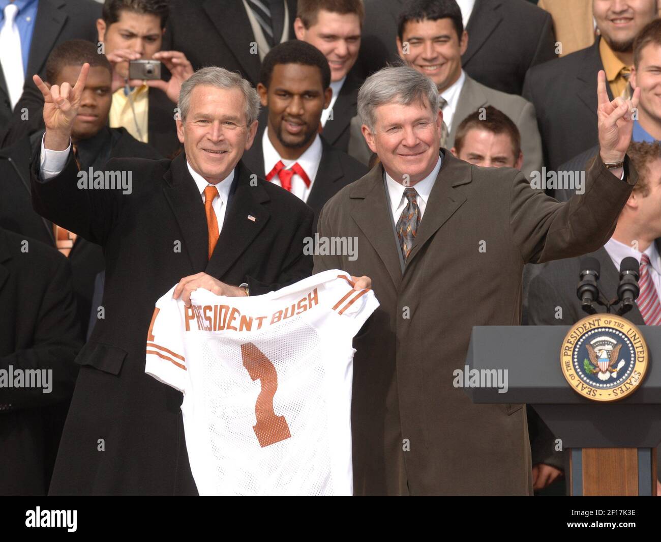 President George W. Bush receives a jersey from Texas Longhorns' head ...