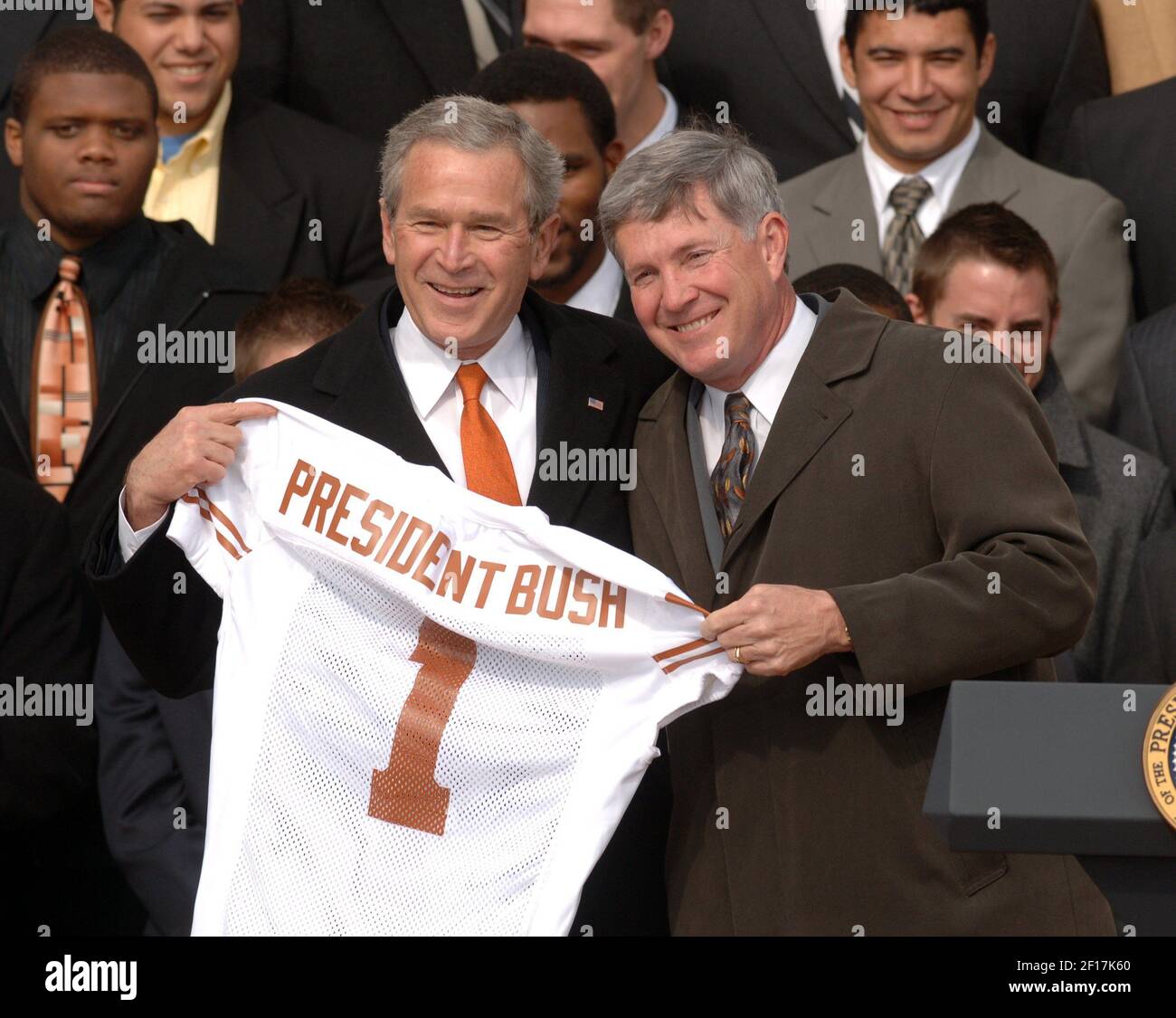 President George W. Bush receives a jersey from Texas Longhorns' head ...