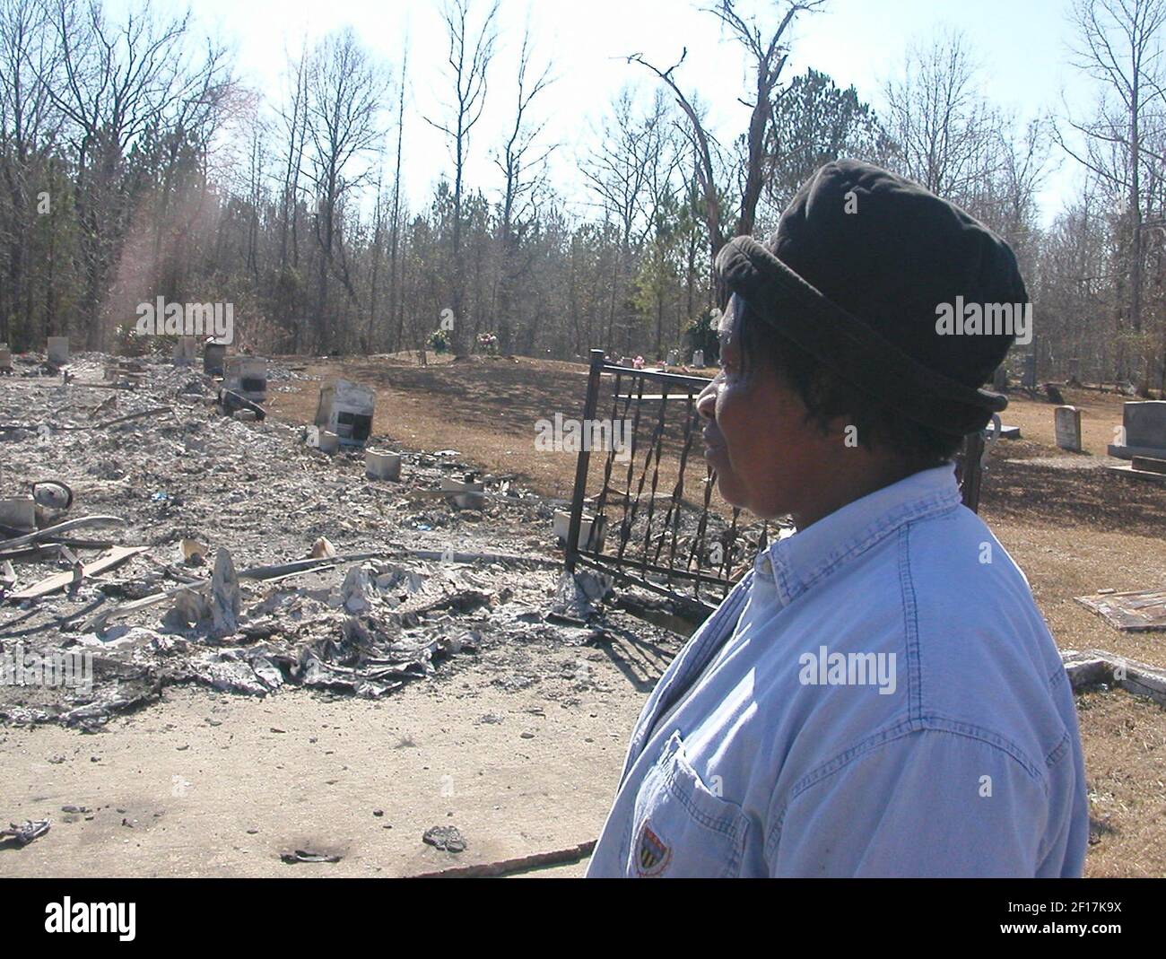 Minnie Oliver stands by the burned remains of the Galilee Baptist ...