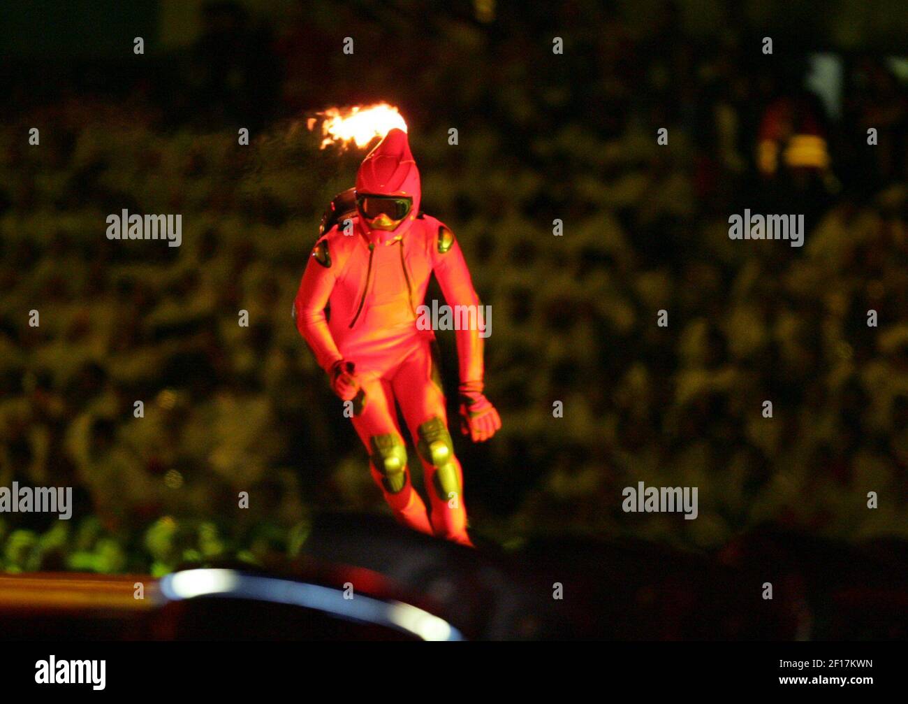 A performer appears during the Sparks of Passion segment of the opening ...