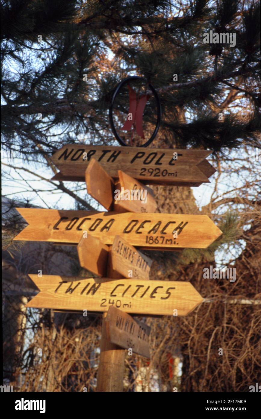 In the Ely, Minnesota Surf Shop, signposts show the distance to other ...