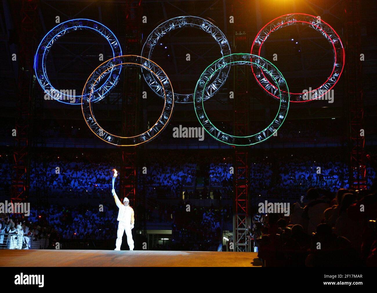 Italian Olympic legend Alberto Tomba carries the torch into Olympic ...
