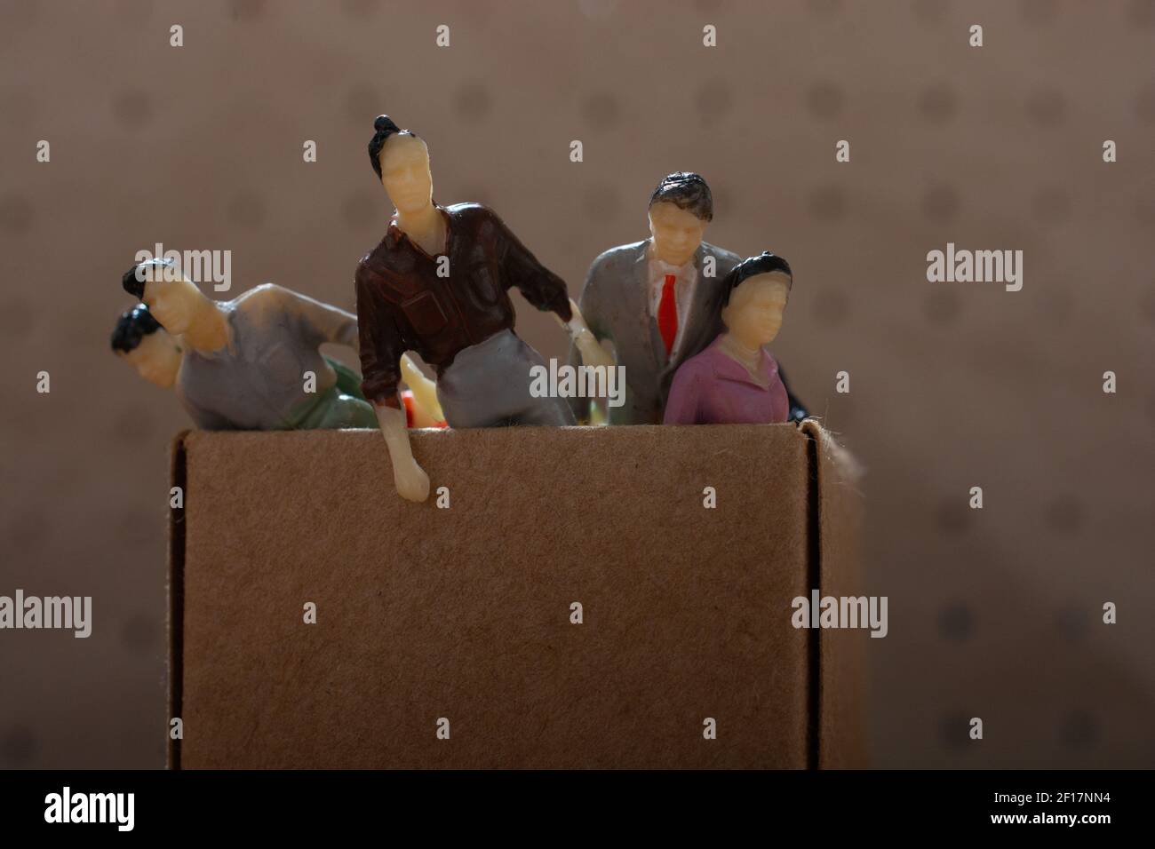 Tiny figurine of men and women miniature model in view Stock Photo - Alamy
