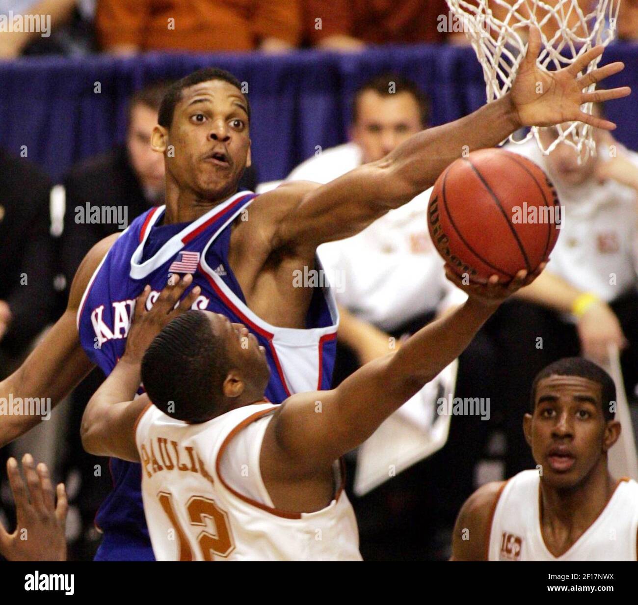 Kansas' C.J. Giles (33) blocks a shot by Texas' Kenton Paulino (12 ...