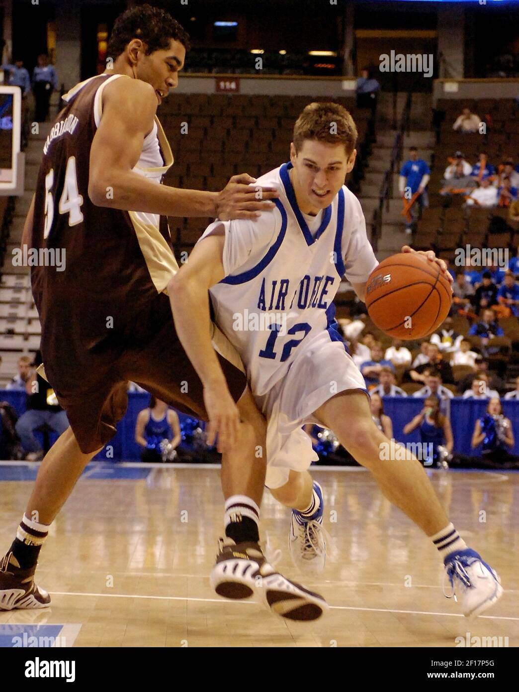 Air Force Academy's Tim Anderson (12) is fouled by Derek Wabbington (54 ...