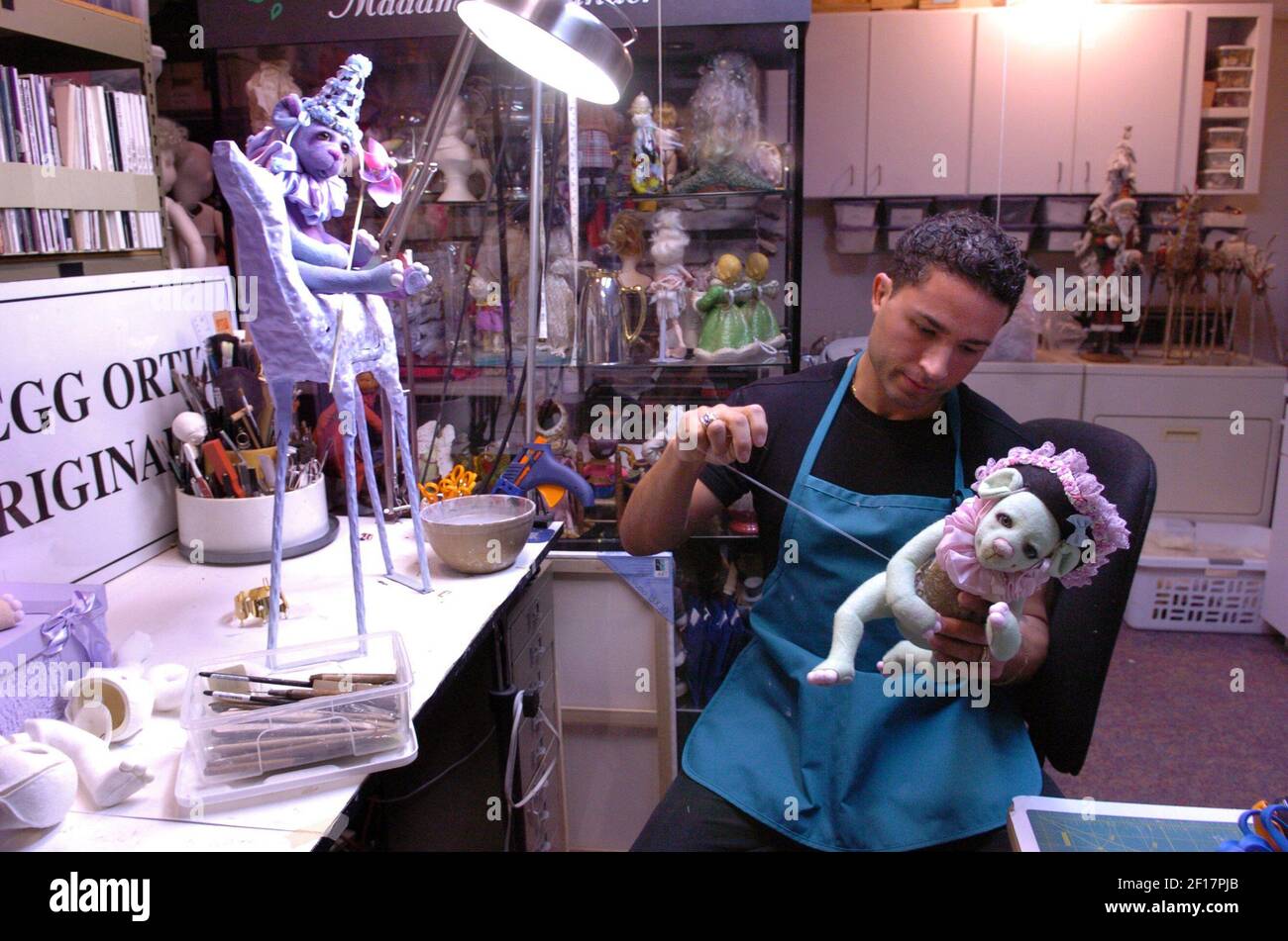 Boxes of notions, paints and patterns surround Greggat his garage ...