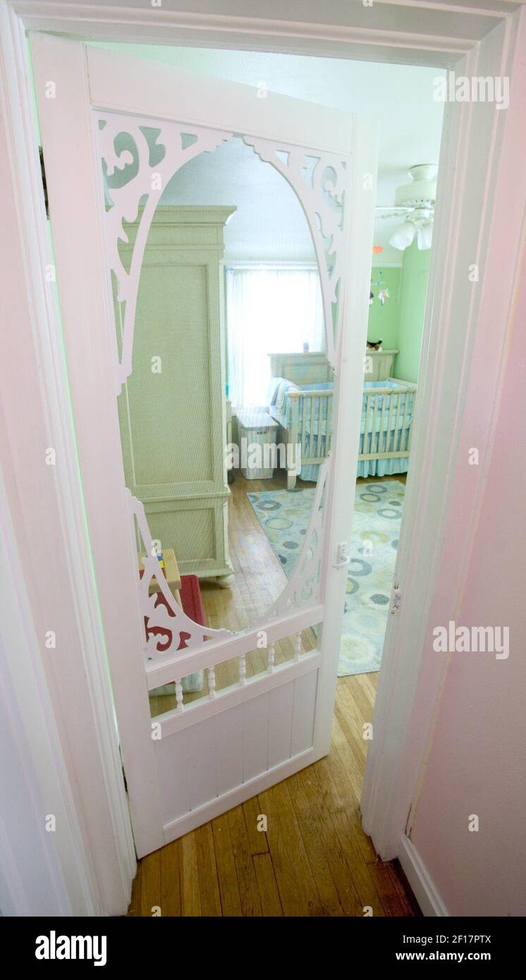 A screened door creates an open, airy feeling for the nursery and ...