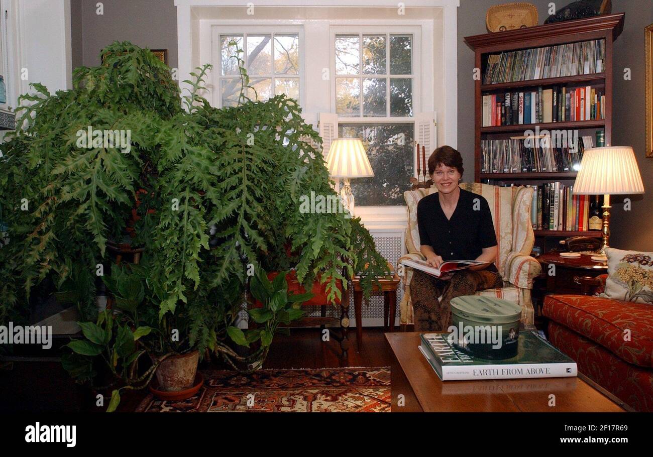 Lynn Cook sits in her living room with "Victoria," her 31-year-old ...