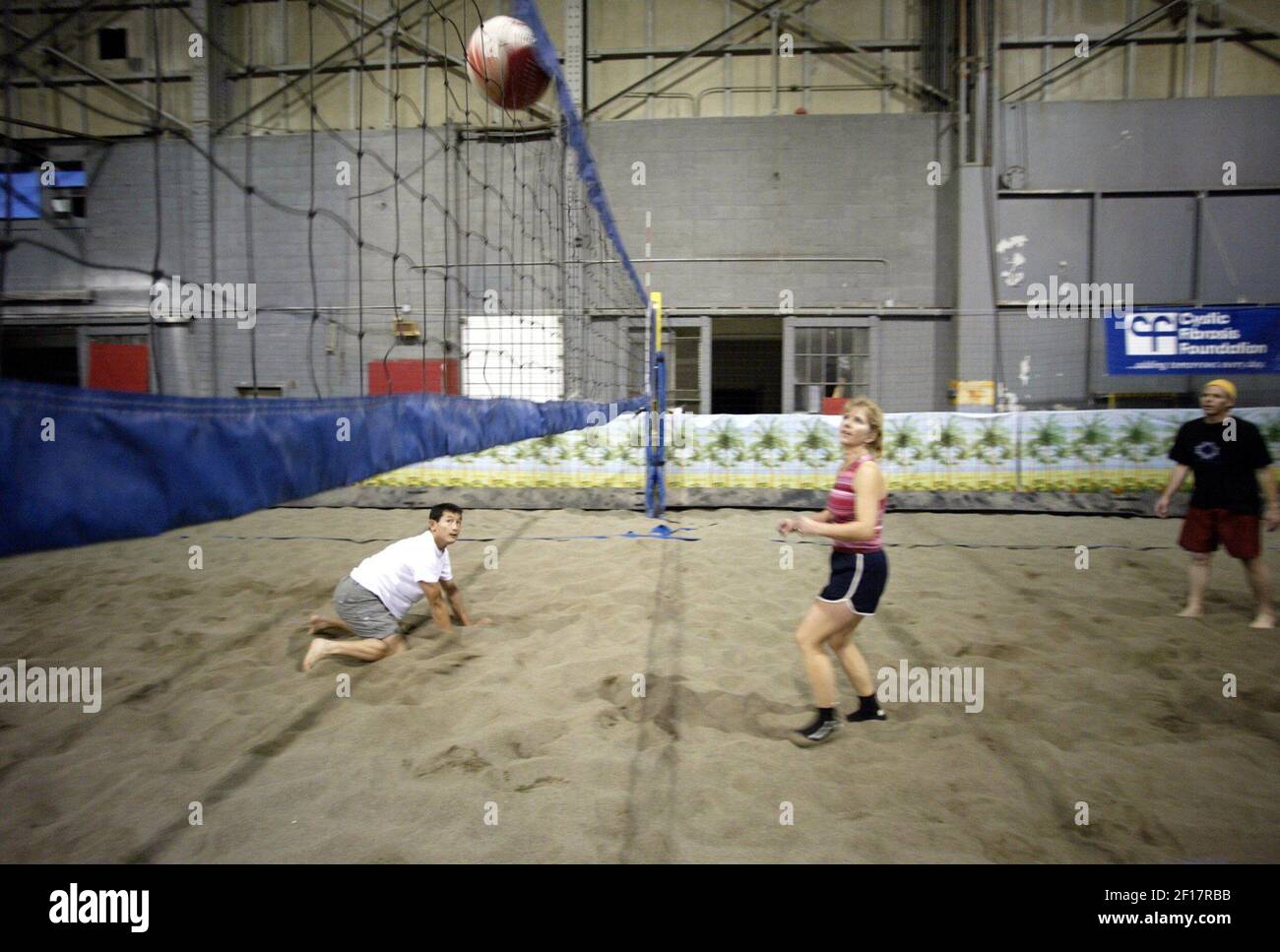 Ed Li, from left, Sally Moneda and Dan Billharz play on one of two ...