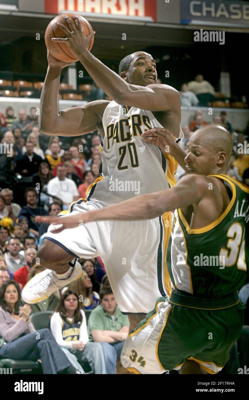 Indiana Pacers' Fred Jones shoots over Seattle SuperSonics' Ray Allen ...