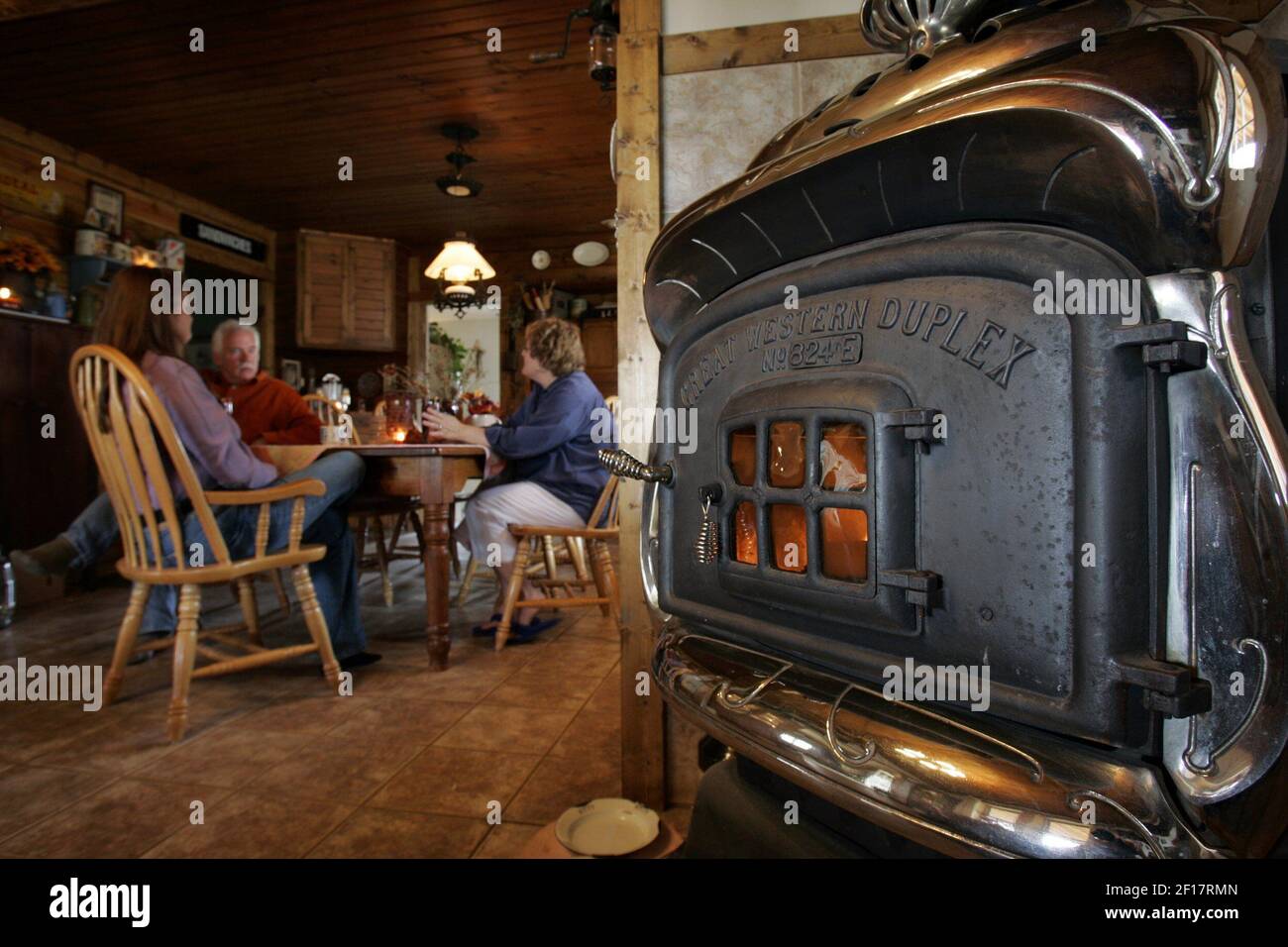A wood-burning stove is the main source of heat in the home of Bert ...