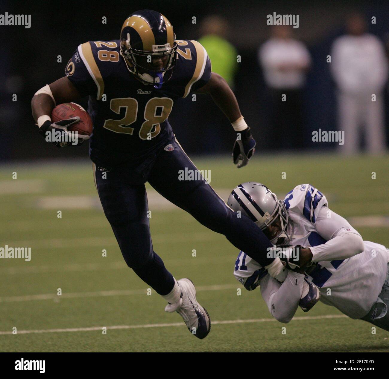 Dallas Cowboys' cornerback Terence Newman makes an open-field tackle on ...