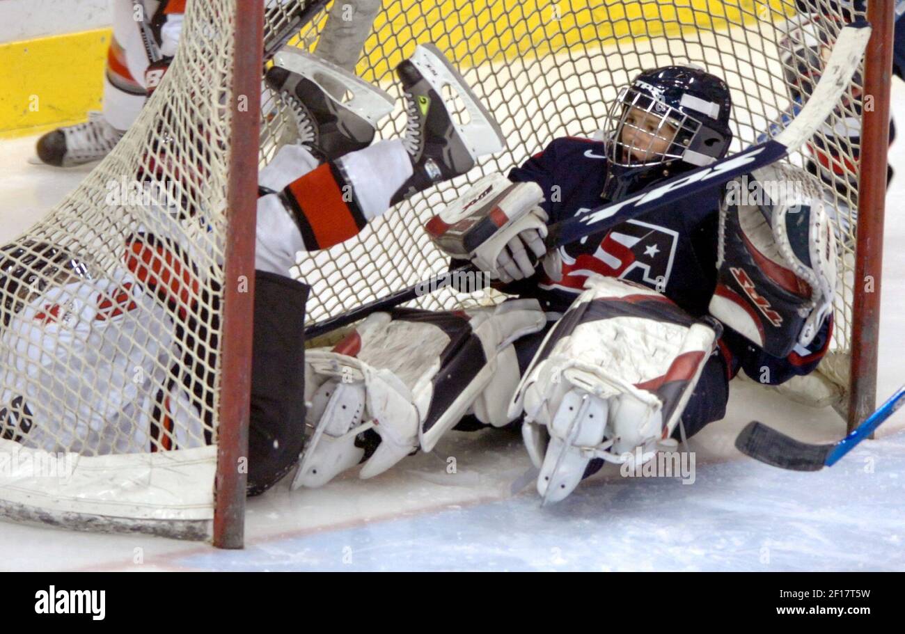 Team USA's goalie Chanda Gunn, right, blocks the puck from entering the ...