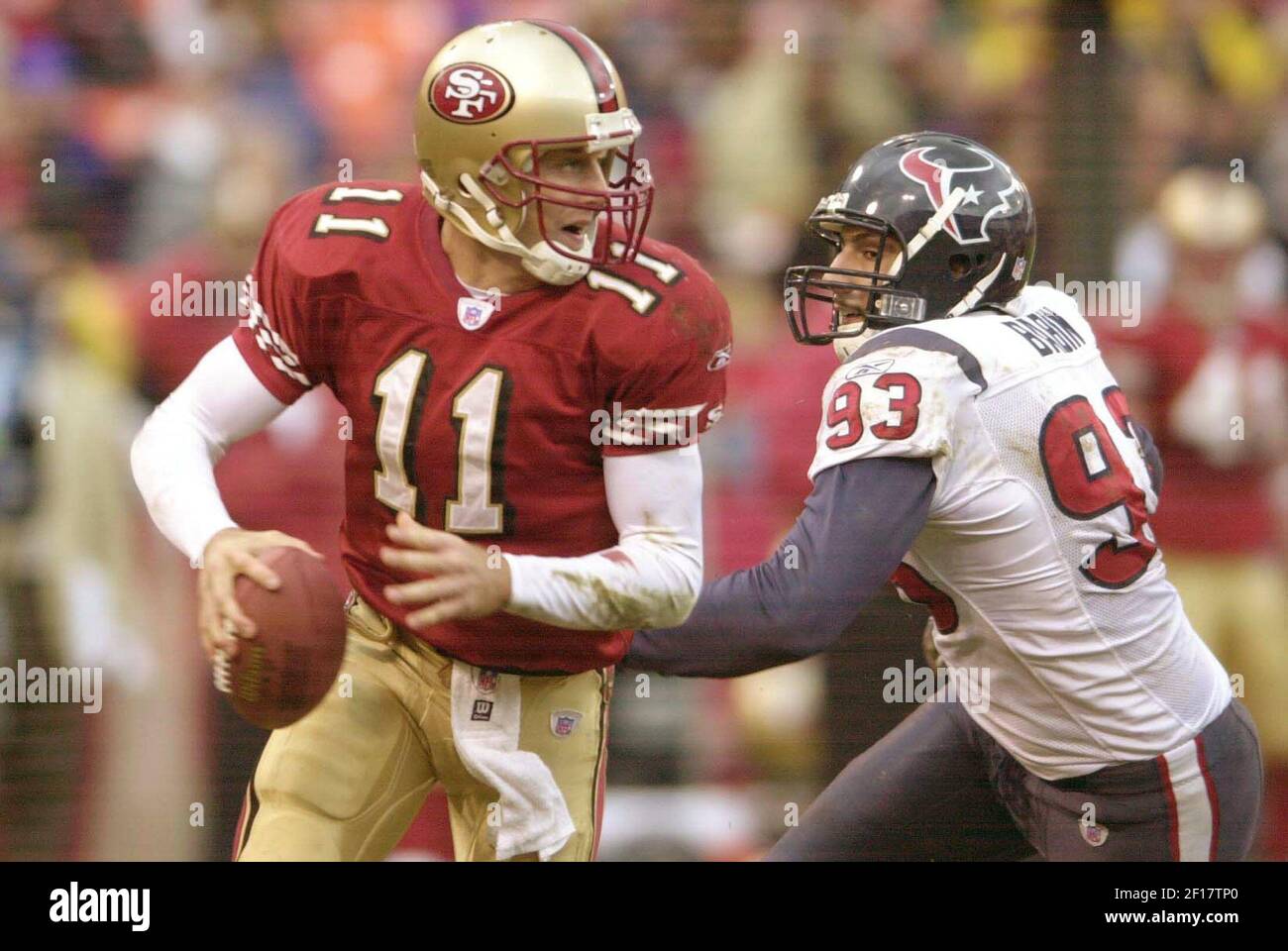 San Francisco 49ers quarterback Alex Smith (11) escapes a tackle from ...