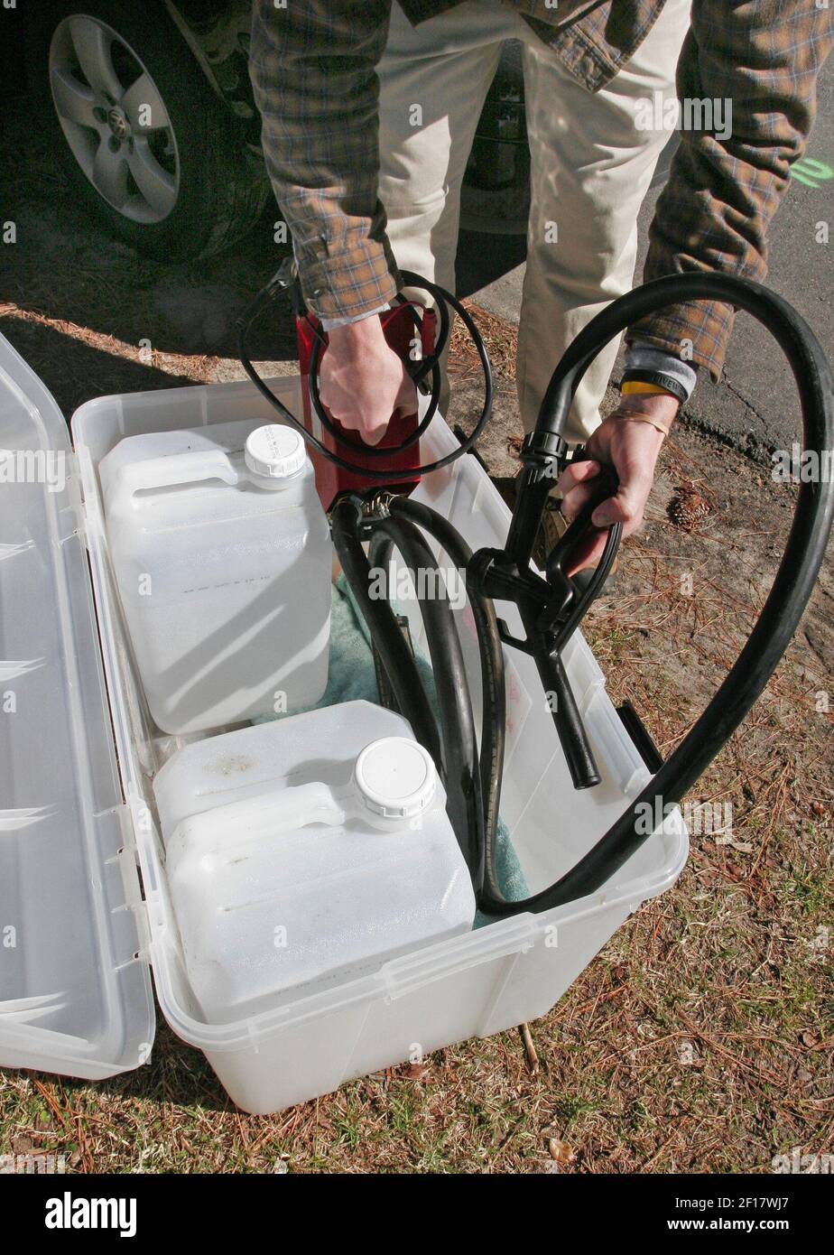 Patrick Mulligan uses this collection kit to collect used oil. He ...