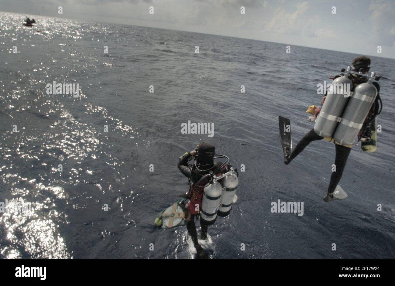 Christine Addison, left, and Jay Styron jump off the deck of the Nancy ...