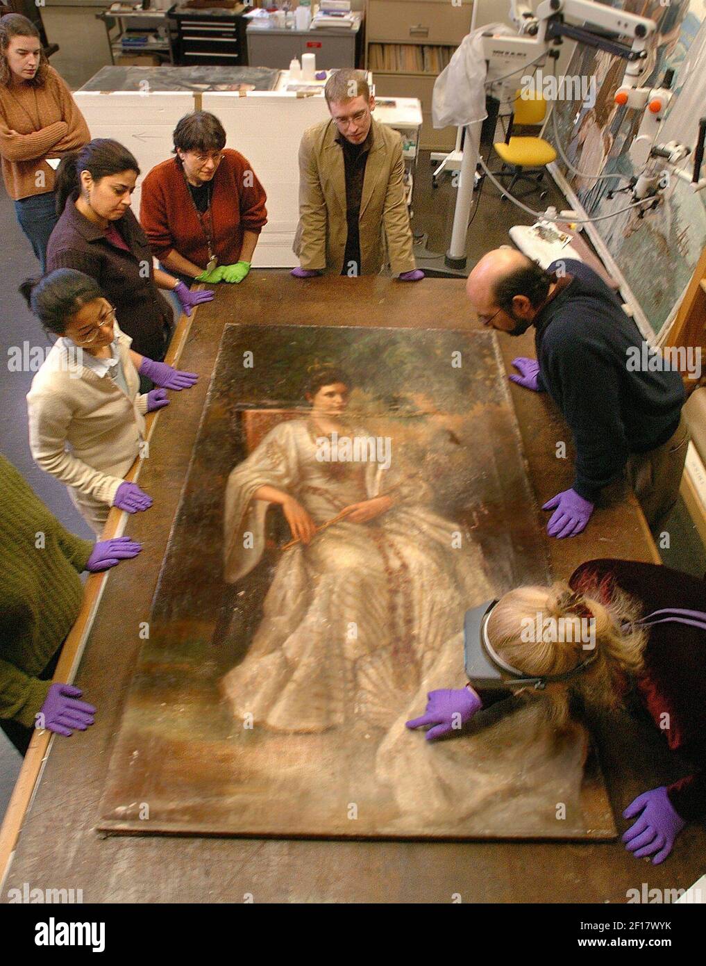 Art conservationists and students at Winterthur Museum, inspect the ...