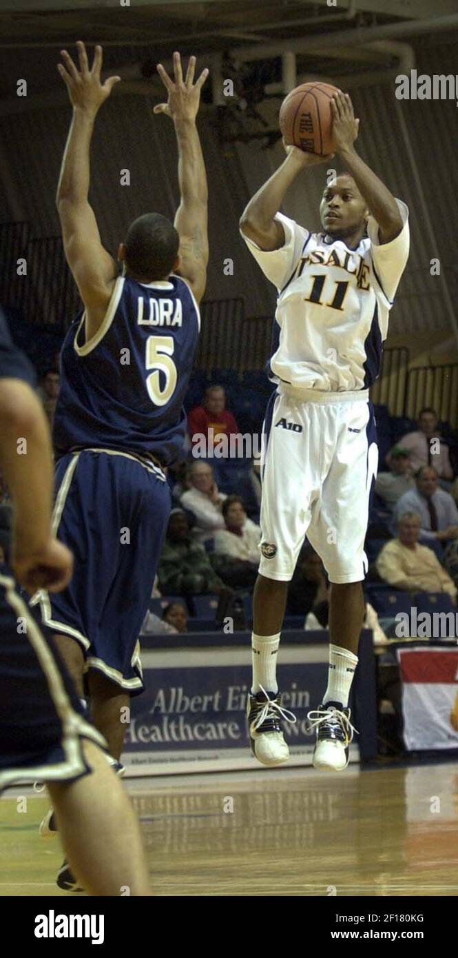 LaSalle's Darnell Harris (11) takes a 3-point shot over Florida ...