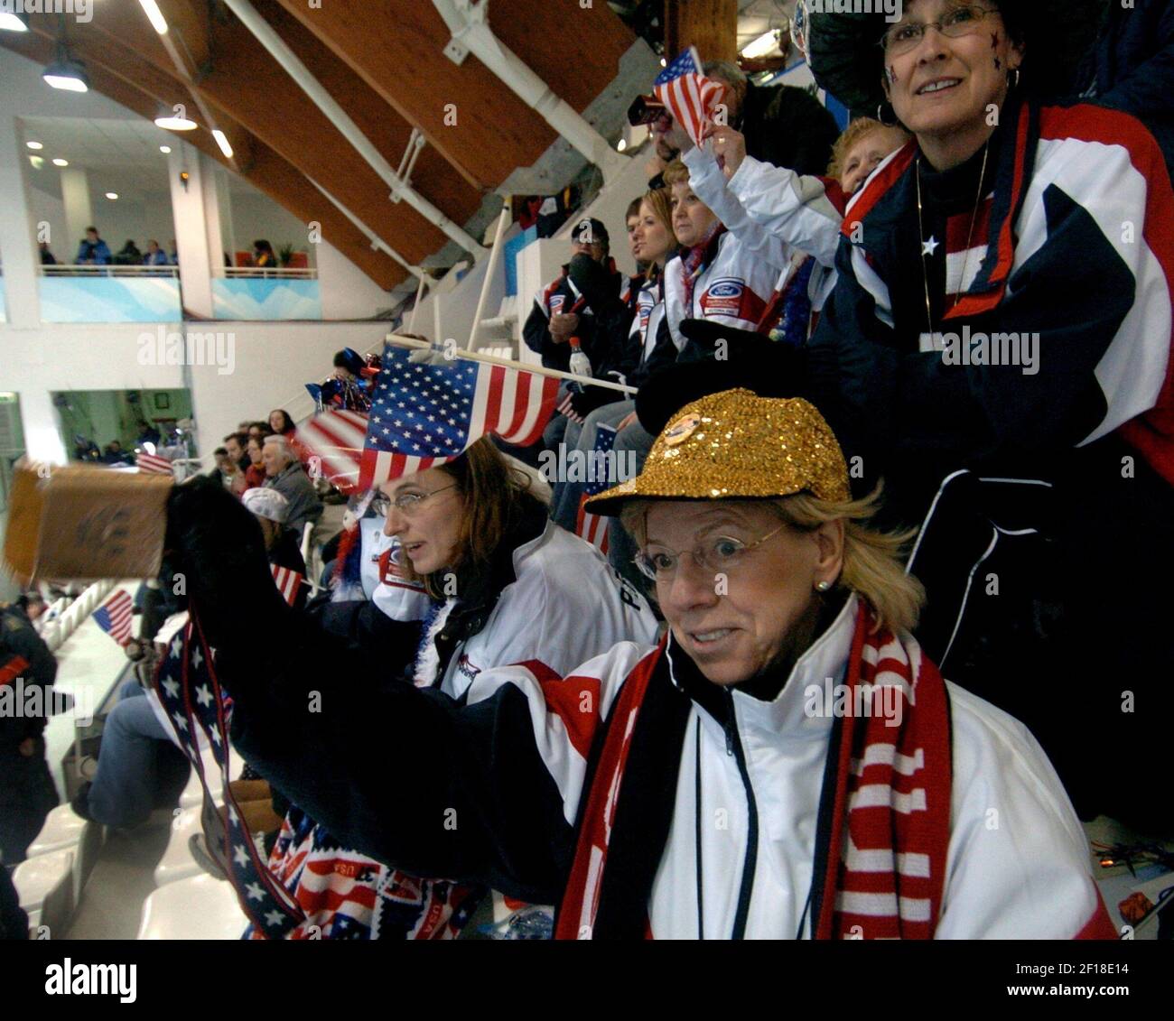 Chris Freeman, center, cheers on her nephew John Shuster, a member of ...
