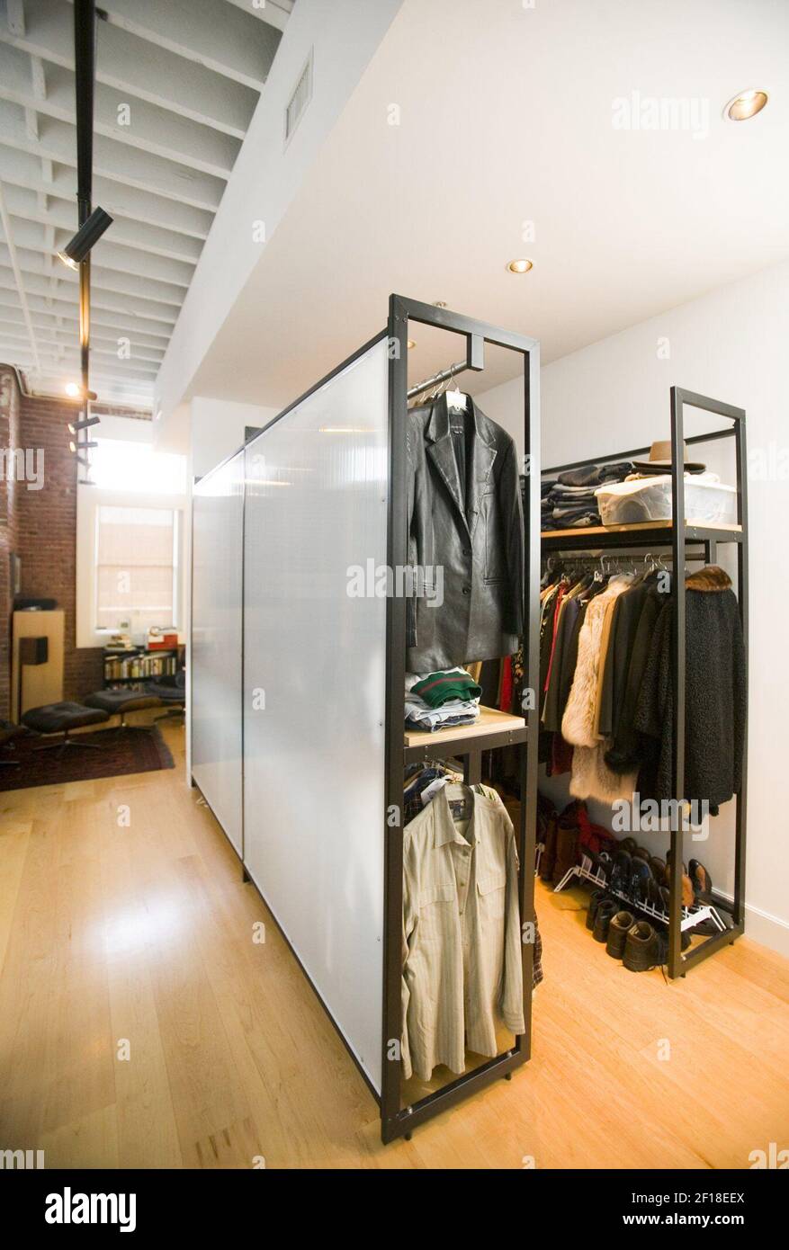 Open-fronted, closed-backed storage units create closet space on one ...