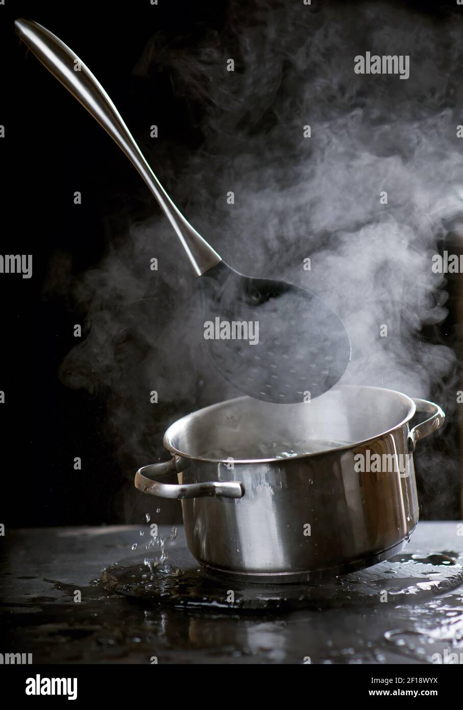 Bubbling water in a pan. Abstract background Stock Photo - Alamy