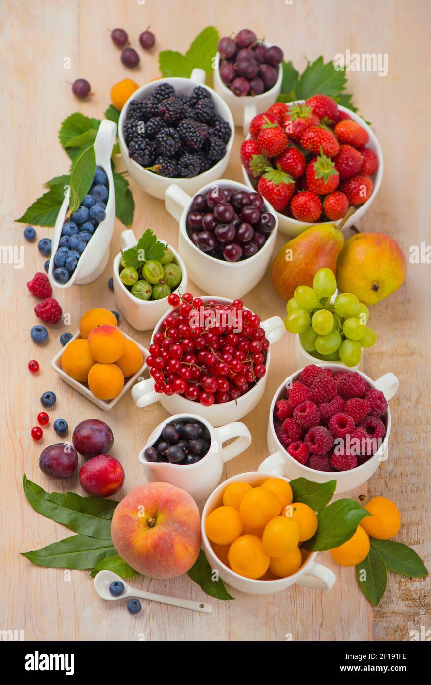 berry mix isolated on a white background Stock Photo - Alamy