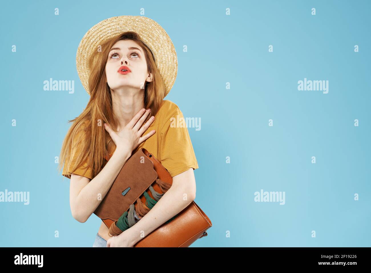 elegant woman hat backpack fashion studio charm models Stock Photo - Alamy