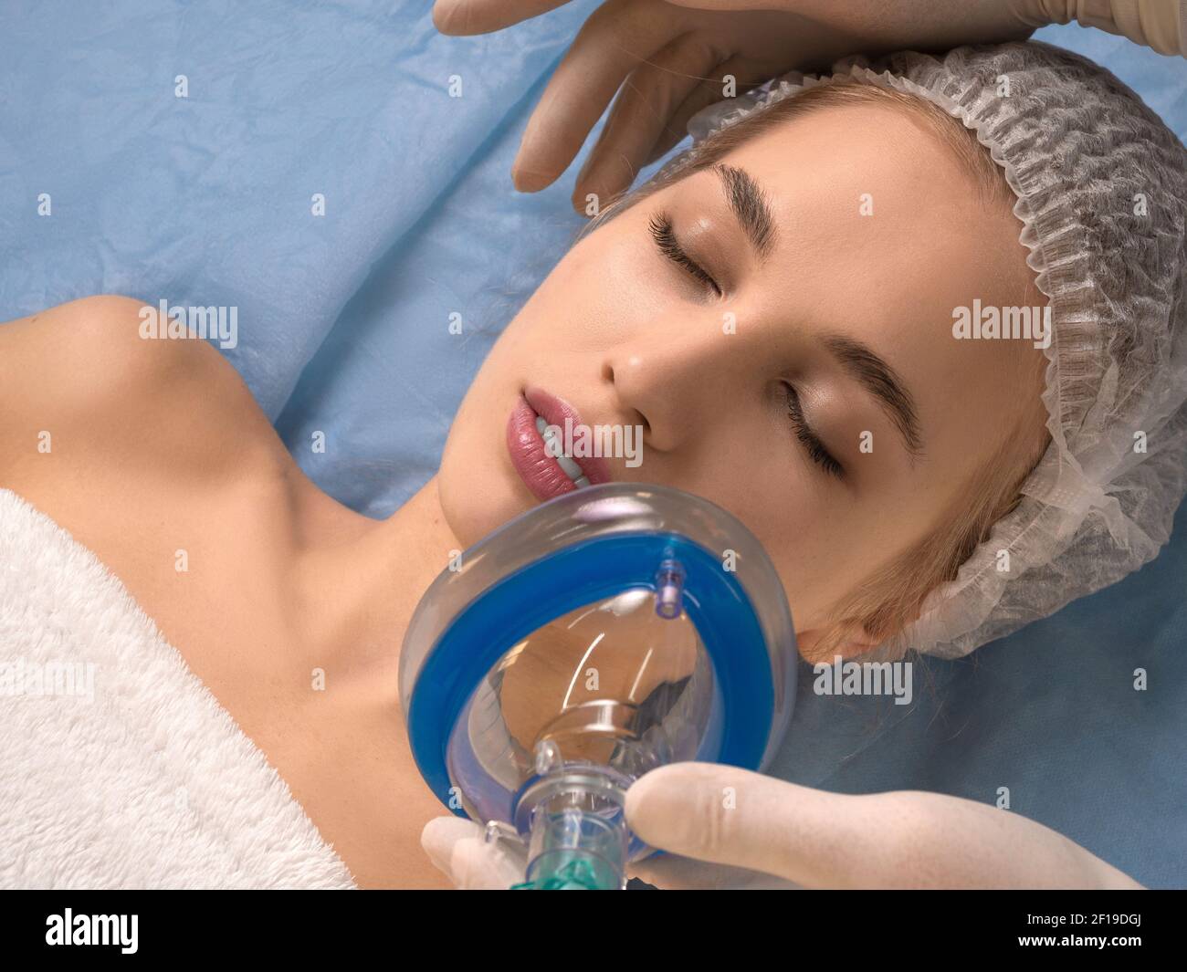 Doctor gives anesthesia to the patient before surgery or beauty ...